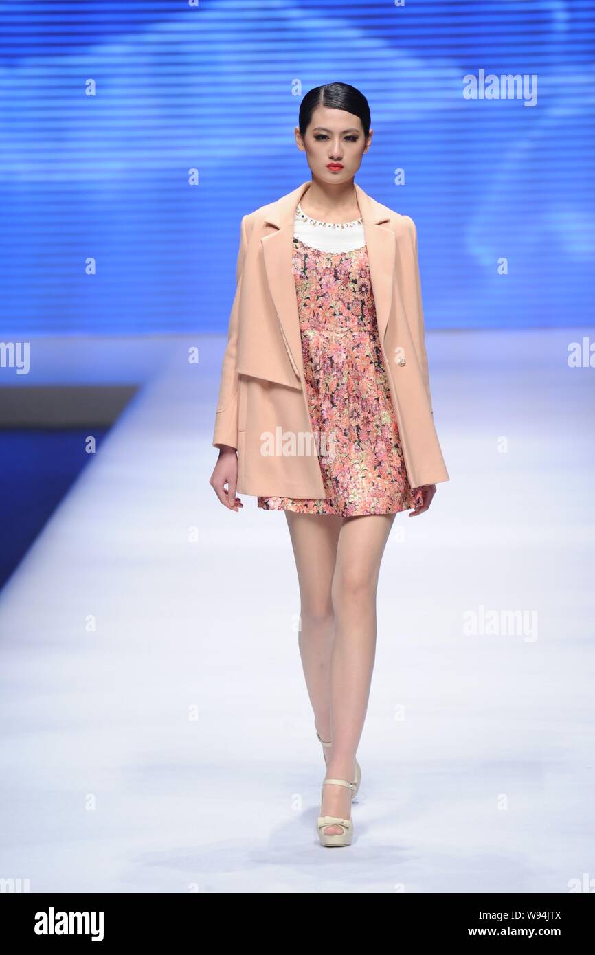A model displays a new creation by Chinese fashion designer Yuan Bing ...