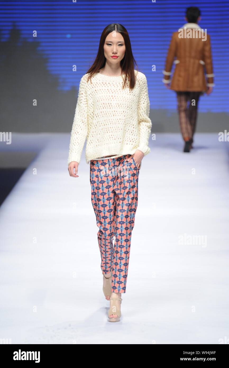 A model displays a new creation by Chinese fashion designer Yuan Bing ...