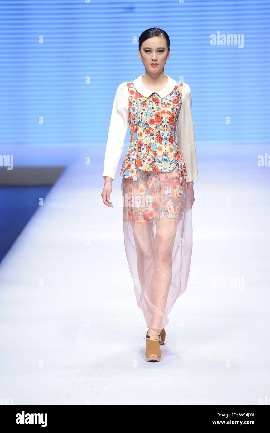 A model displays a new creation by Chinese fashion designer Yuan Bing ...