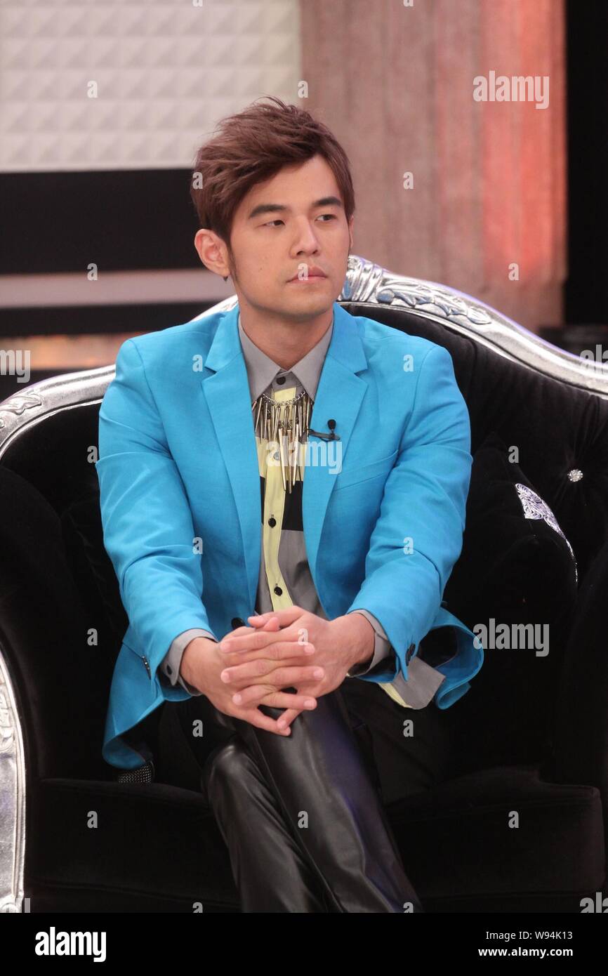 Taiwanese singer and actor Jay Chou reacts during a record of TV show ...