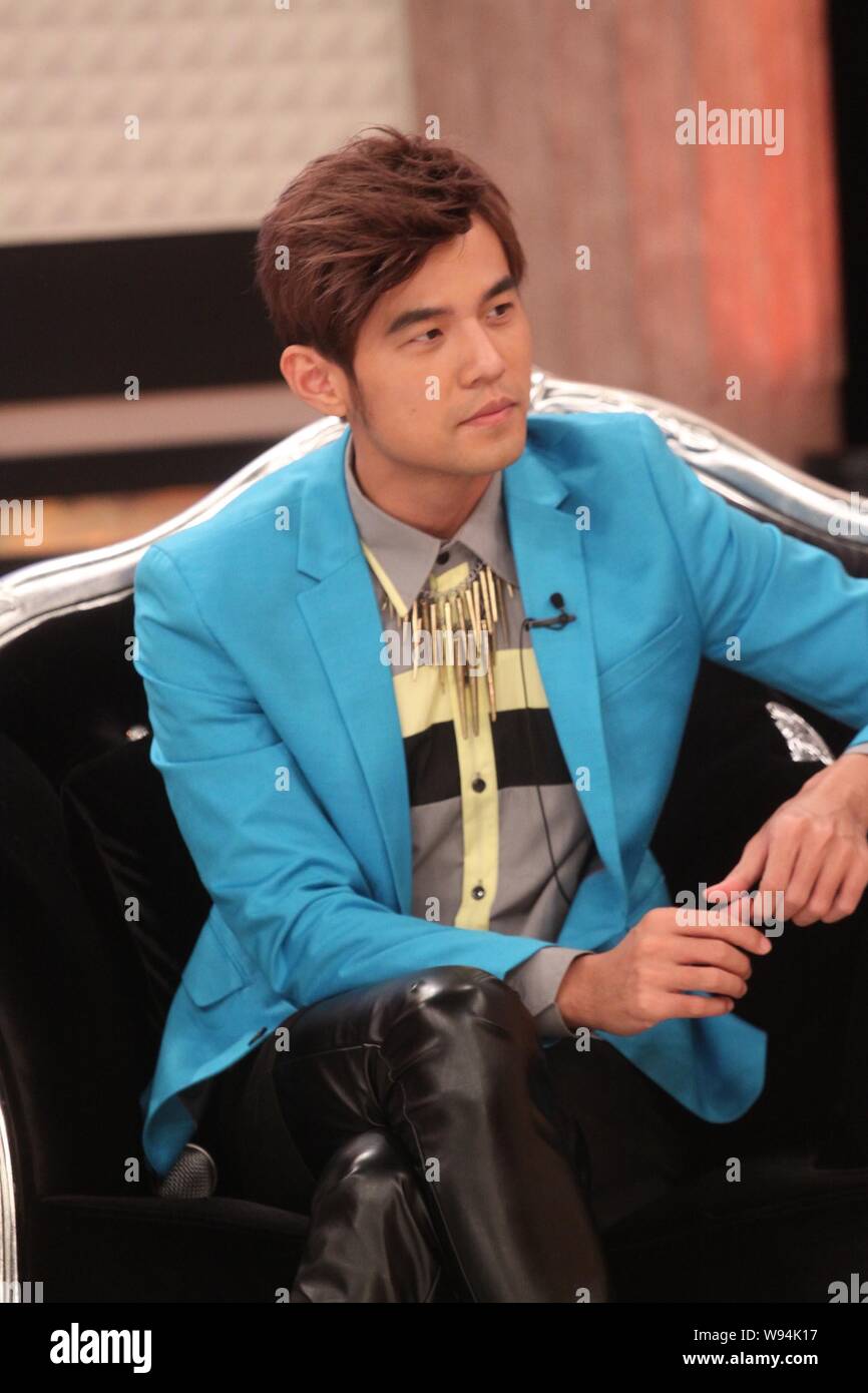 Taiwanese singer and actor Jay Chou smiles during a record of TV show ...