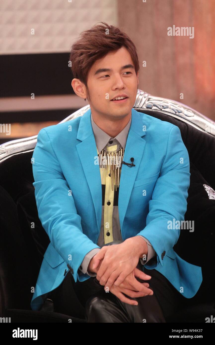 Taiwanese singer and actor Jay Chou reacts during a record of TV show ...