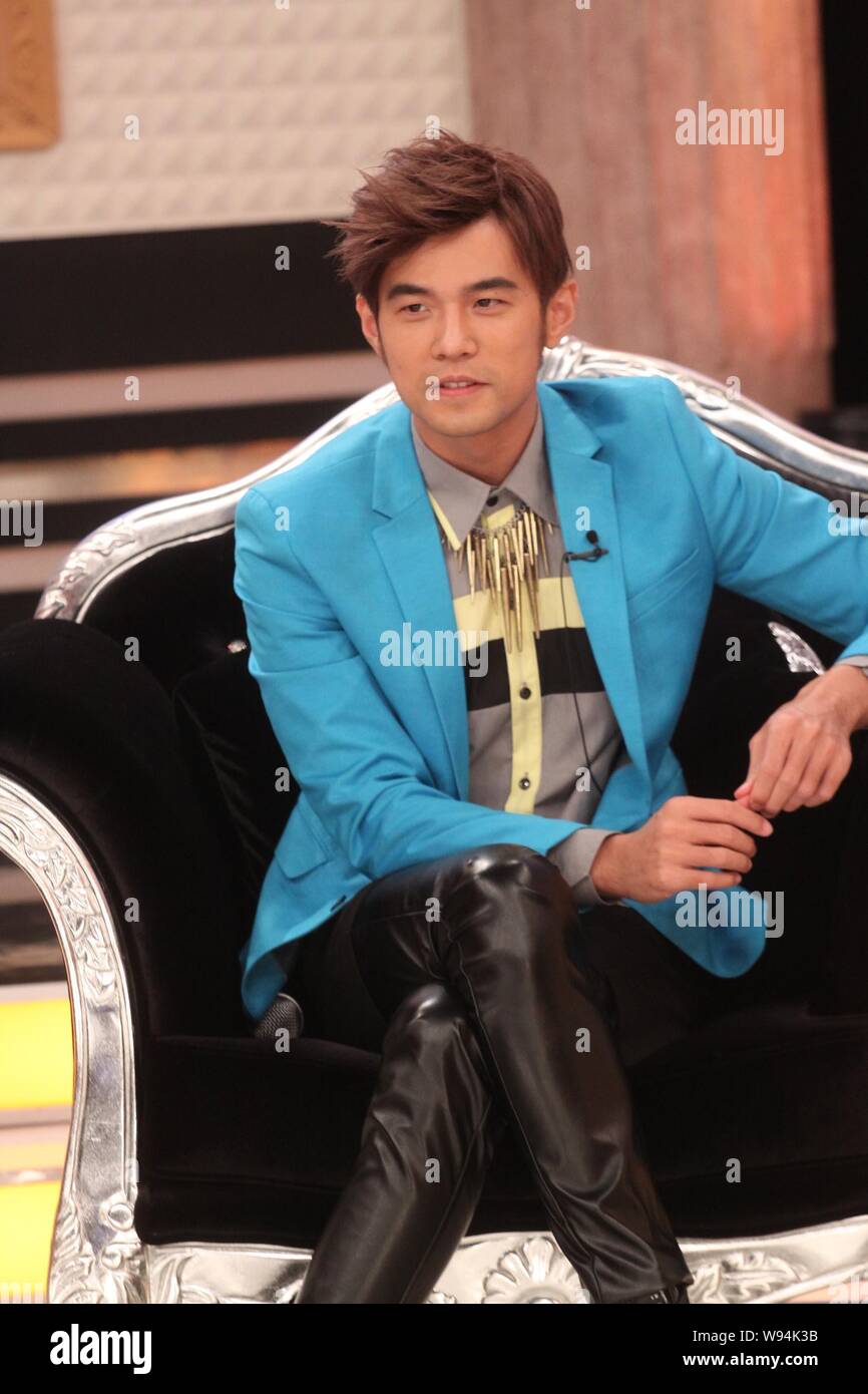 Taiwanese singer and actor Jay Chou smiles during a record of TV show ...
