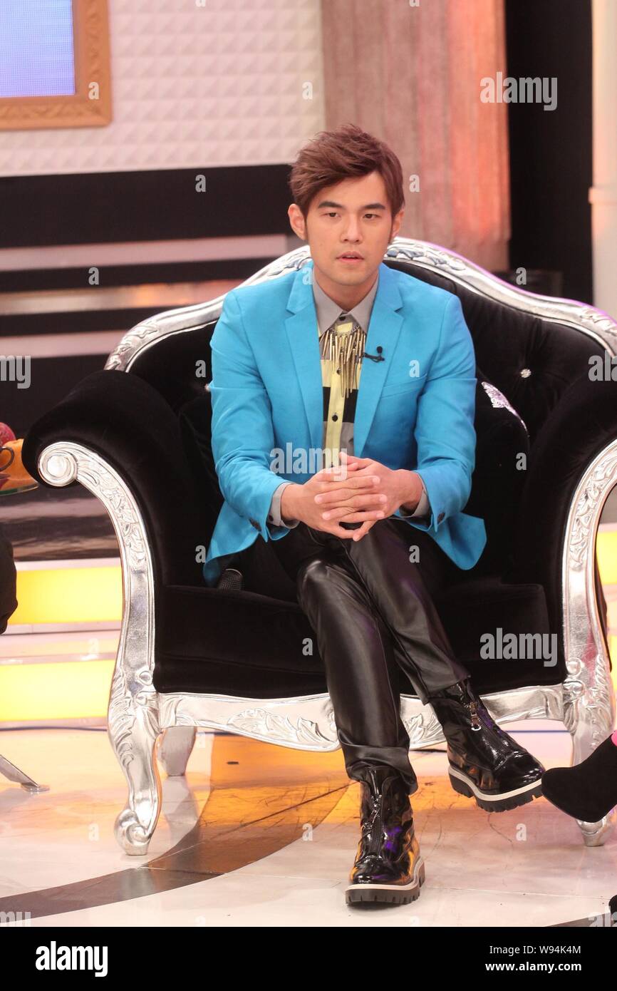 Taiwanese singer and actor Jay Chou reacts during a record of TV show ...