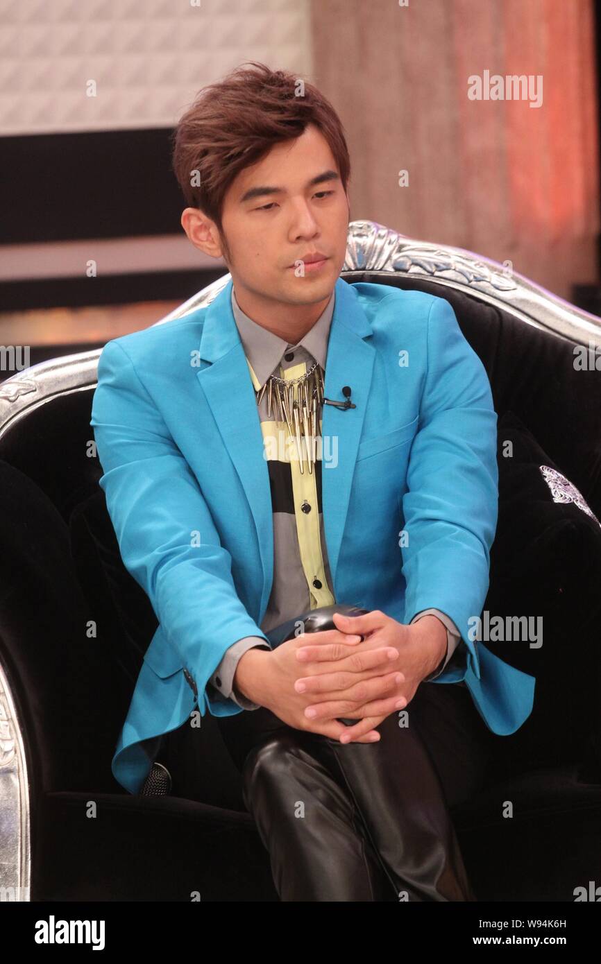 Taiwanese singer and actor Jay Chou reacts during a record of TV show ...