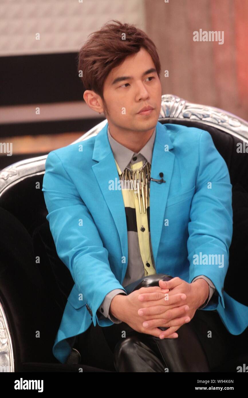 Taiwanese singer and actor Jay Chou reacts during a record of TV show ...