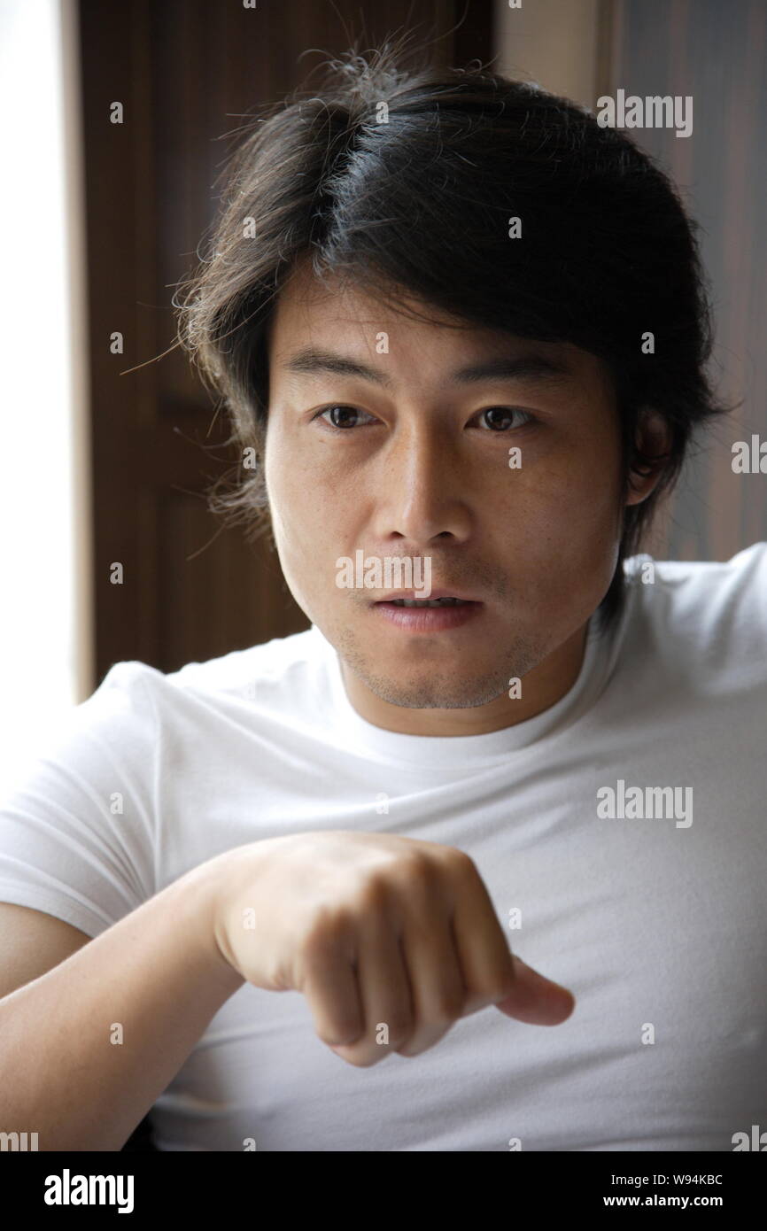 --FILE--Chinese soccer star Shen Si answers a question during an ...