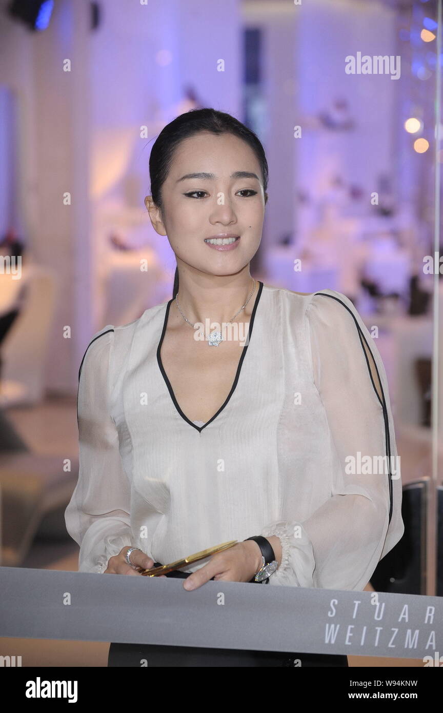 Chinese actress Gong Li cuts the ribbon during the opening ceremony for ...