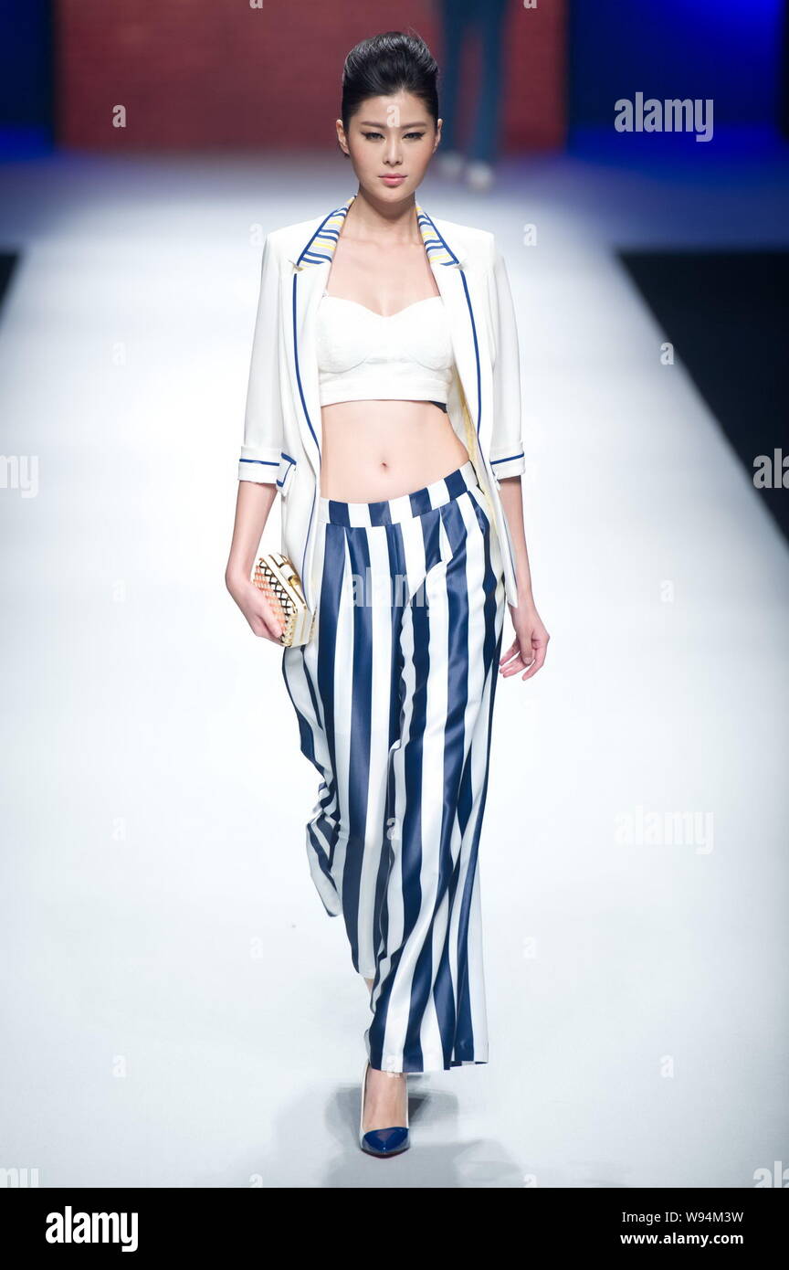 A model displays a new creation at the VISCAP-Yuan Bing fashion show ...