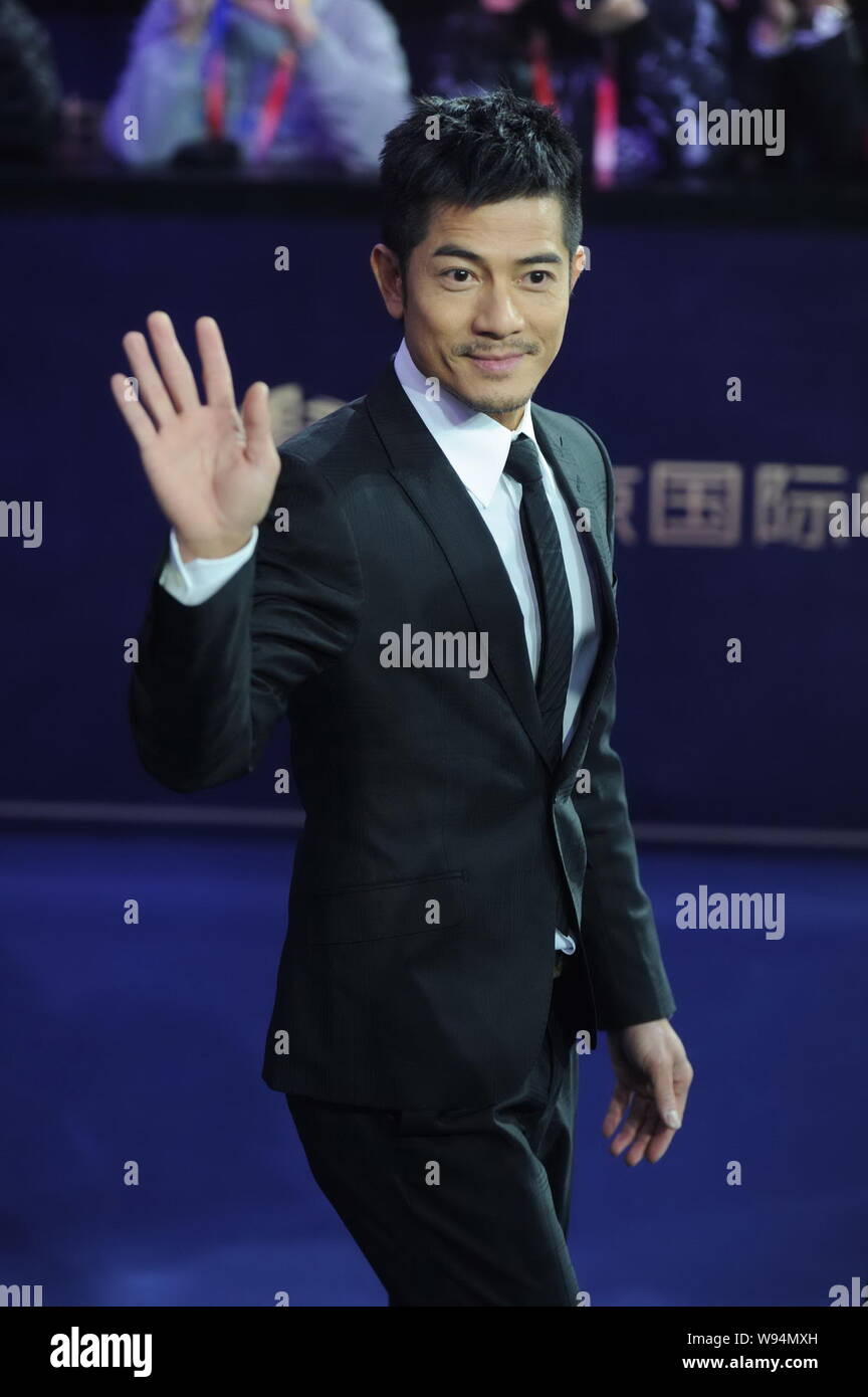 Hong Kong singer and actor Aaron Kwok waves as he arrives for the ...