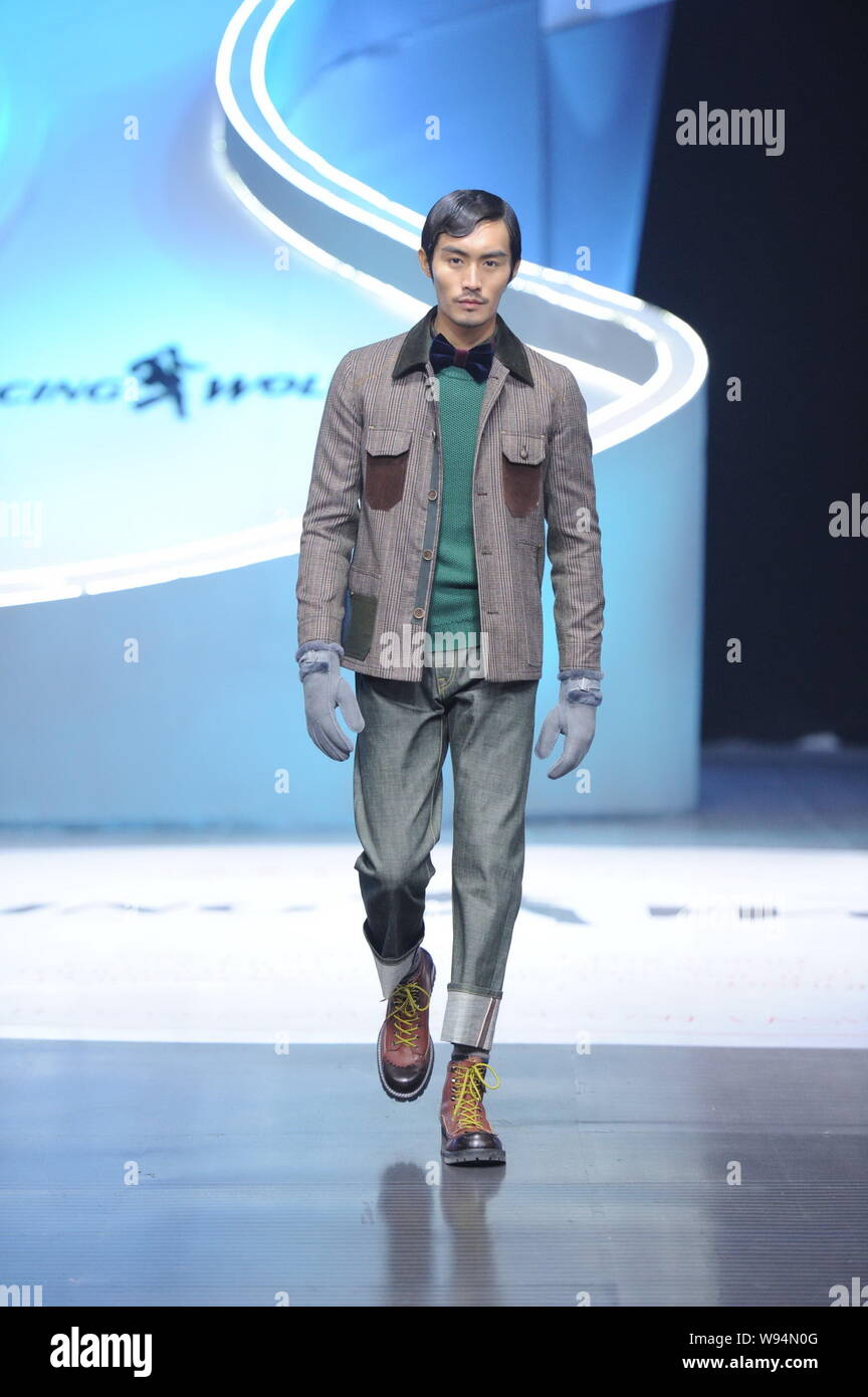 A model displays a new creation in the Dancing Wolves Mens Collection ...