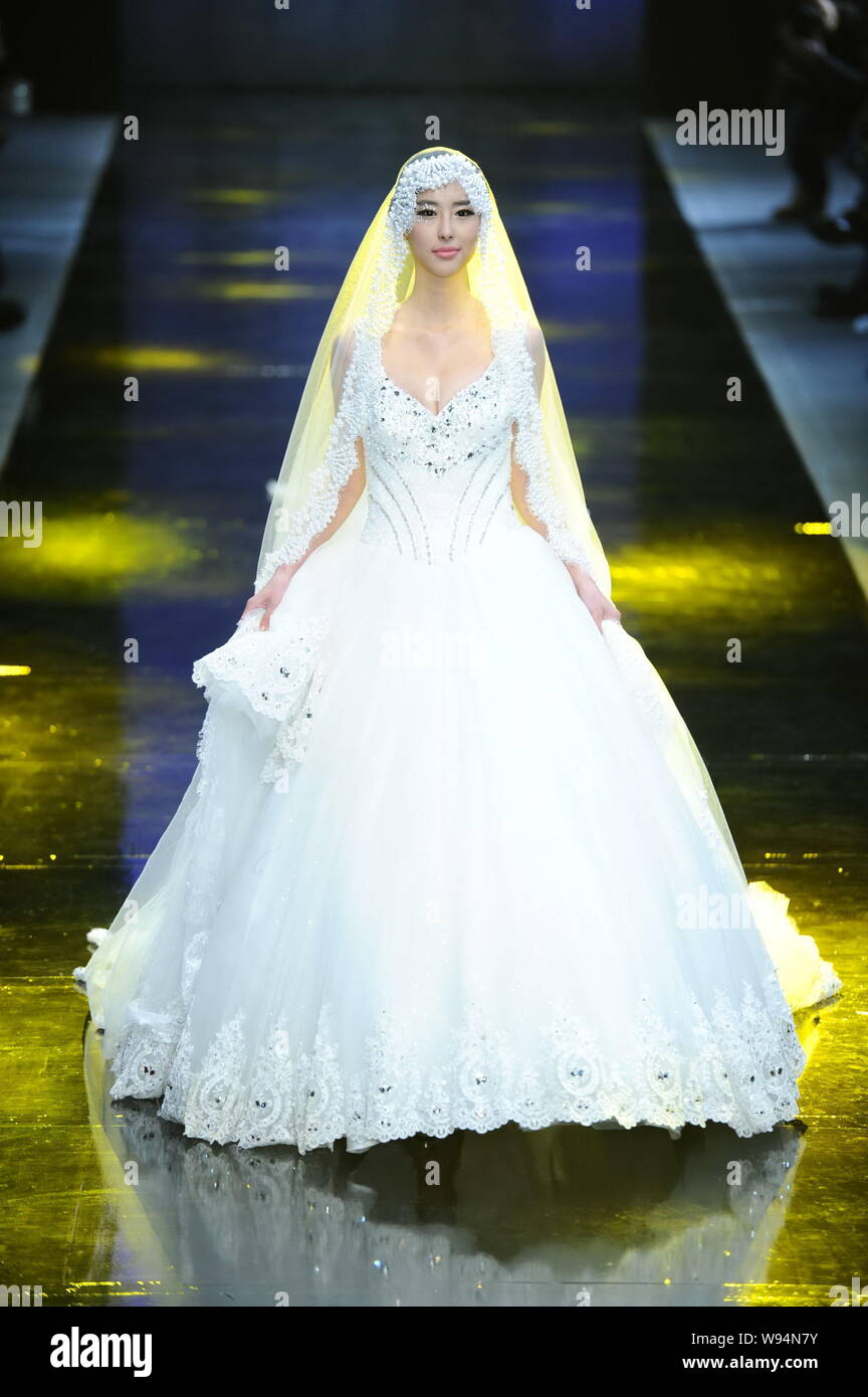 Chinese model Zhai Ling displays a new creation by Chinese fashion ...