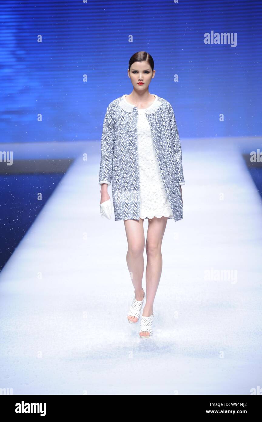 Chinese model Mo Wandan displays a new creation by Chinese fashion ...
