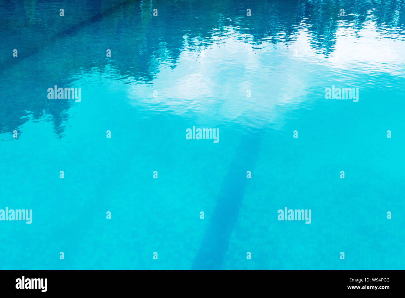 Blue swimming pool water as background with reflections Stock Photo - Alamy
