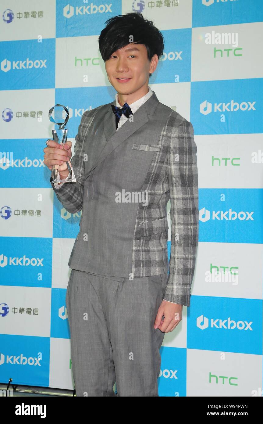 Singaporean singer JJ Lin poses holding his trophy during the 8th KKBOX ...