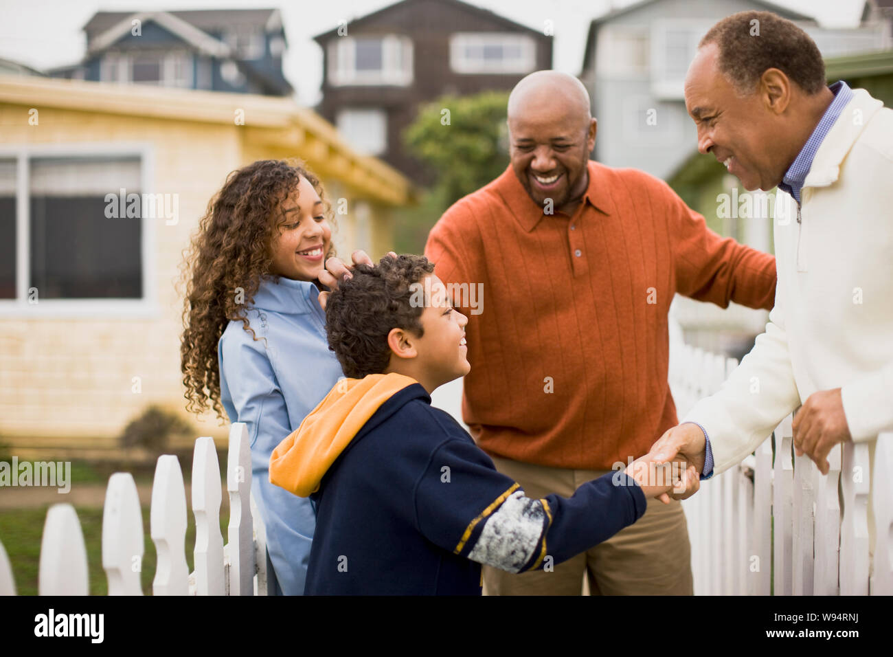 Father, son and daughter visiting Grandfather Stock Photo - Alamy