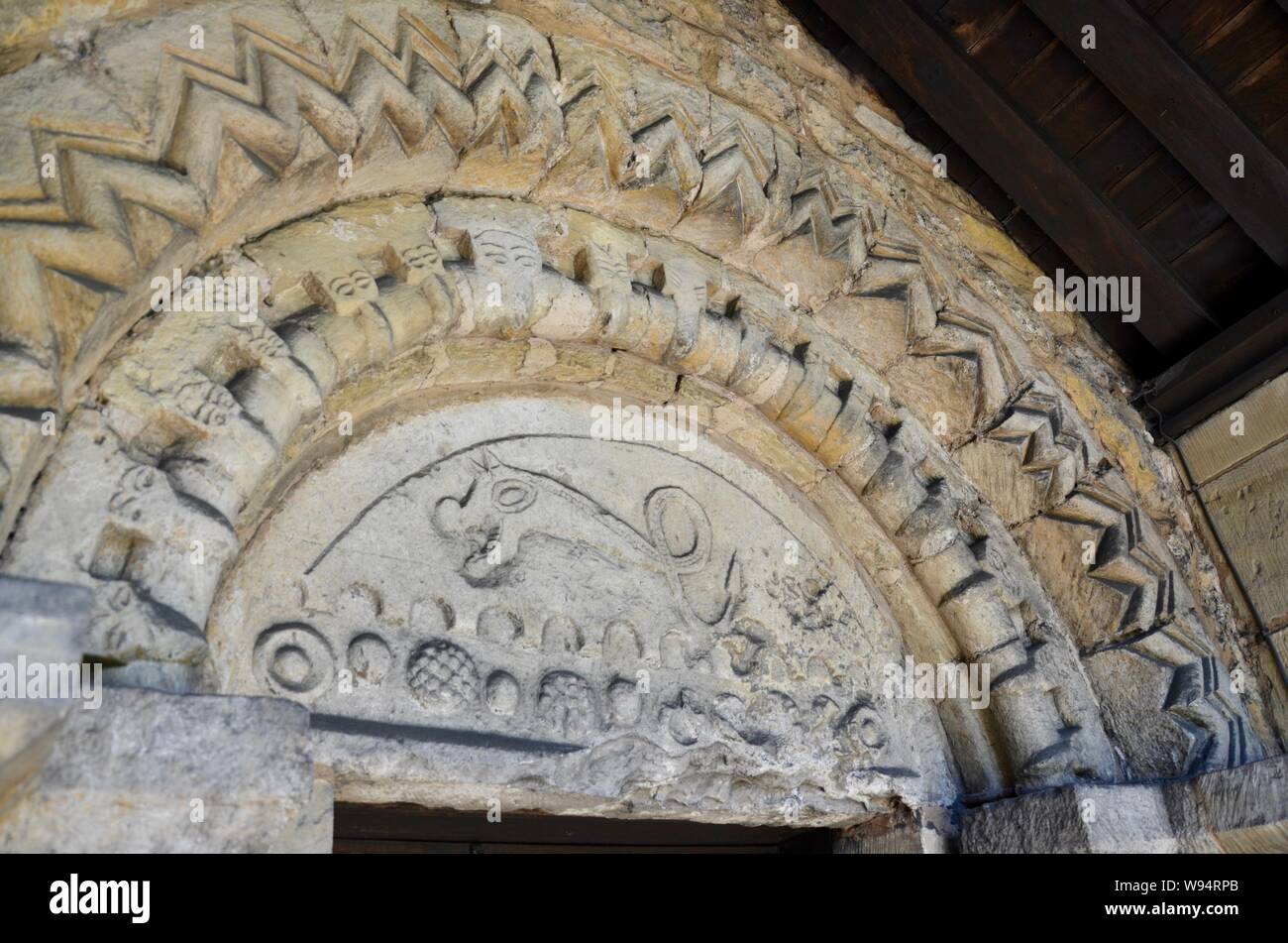 11th century stone carvings above the door of St. Helen’s Church ...