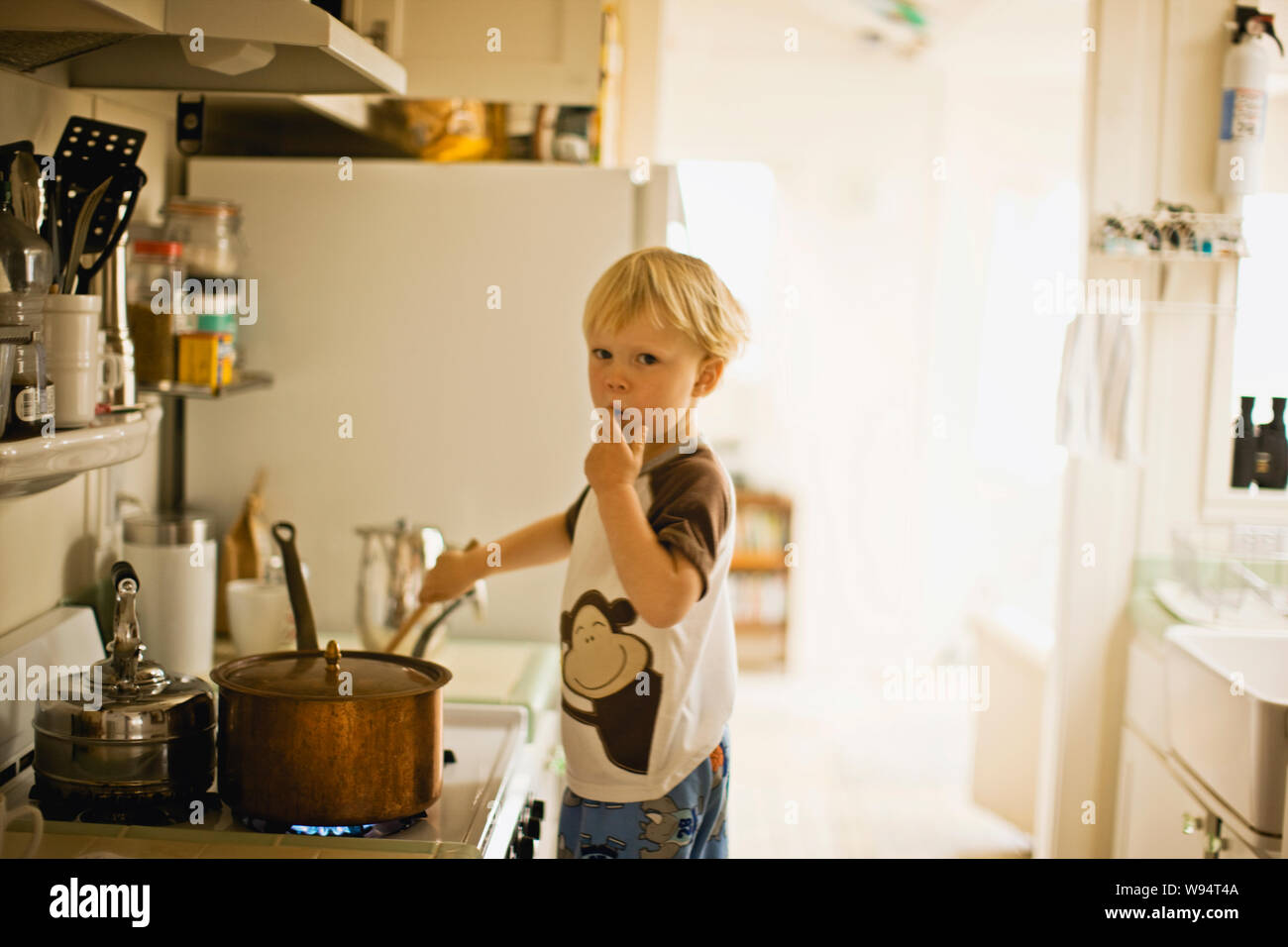 Little boy cooking in the kitchen Stock Photo - Alamy