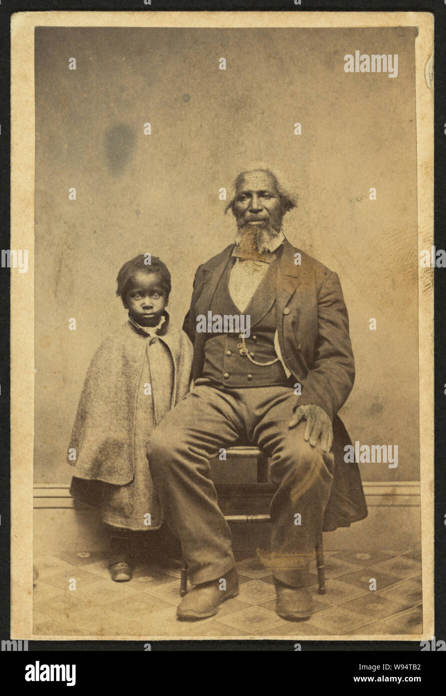 African American man and child, full-length portrait, facing front ...