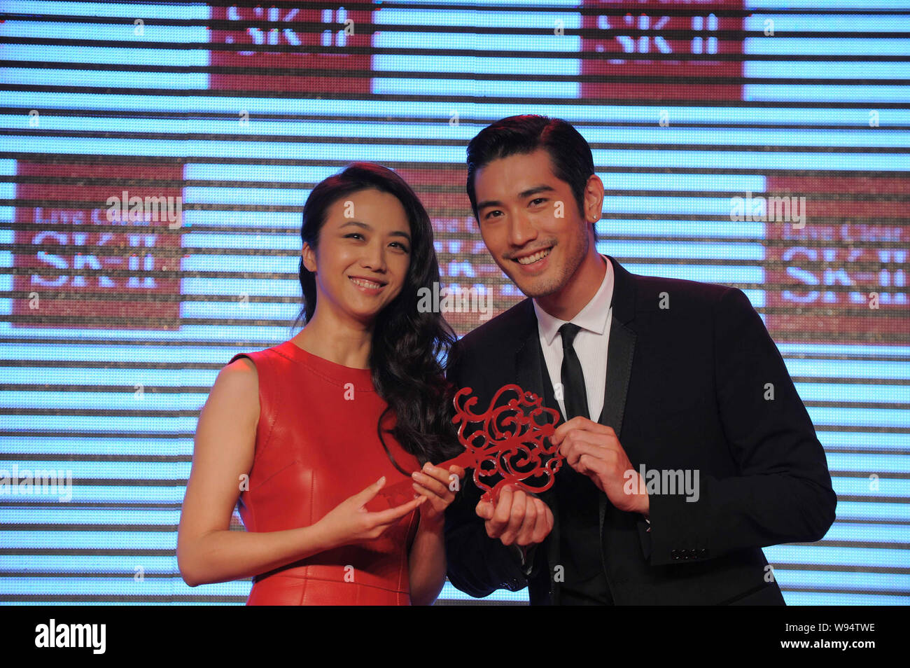 Chinese actress Tang Wei poses with Taiwanese actor Godfrey Kao during ...