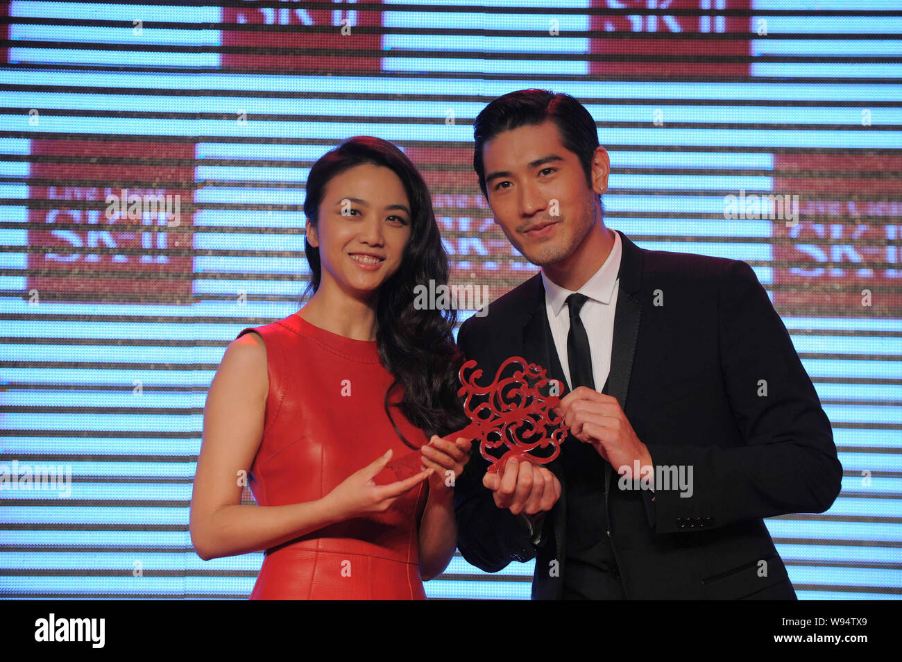 Chinese actress Tang Wei poses with Taiwanese actor Godfrey Kao during ...