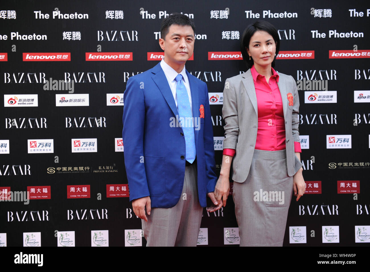 Hong Kong singer Faye Wong, right, and her actor husband Li Yapeng pose on the red carpet as ...