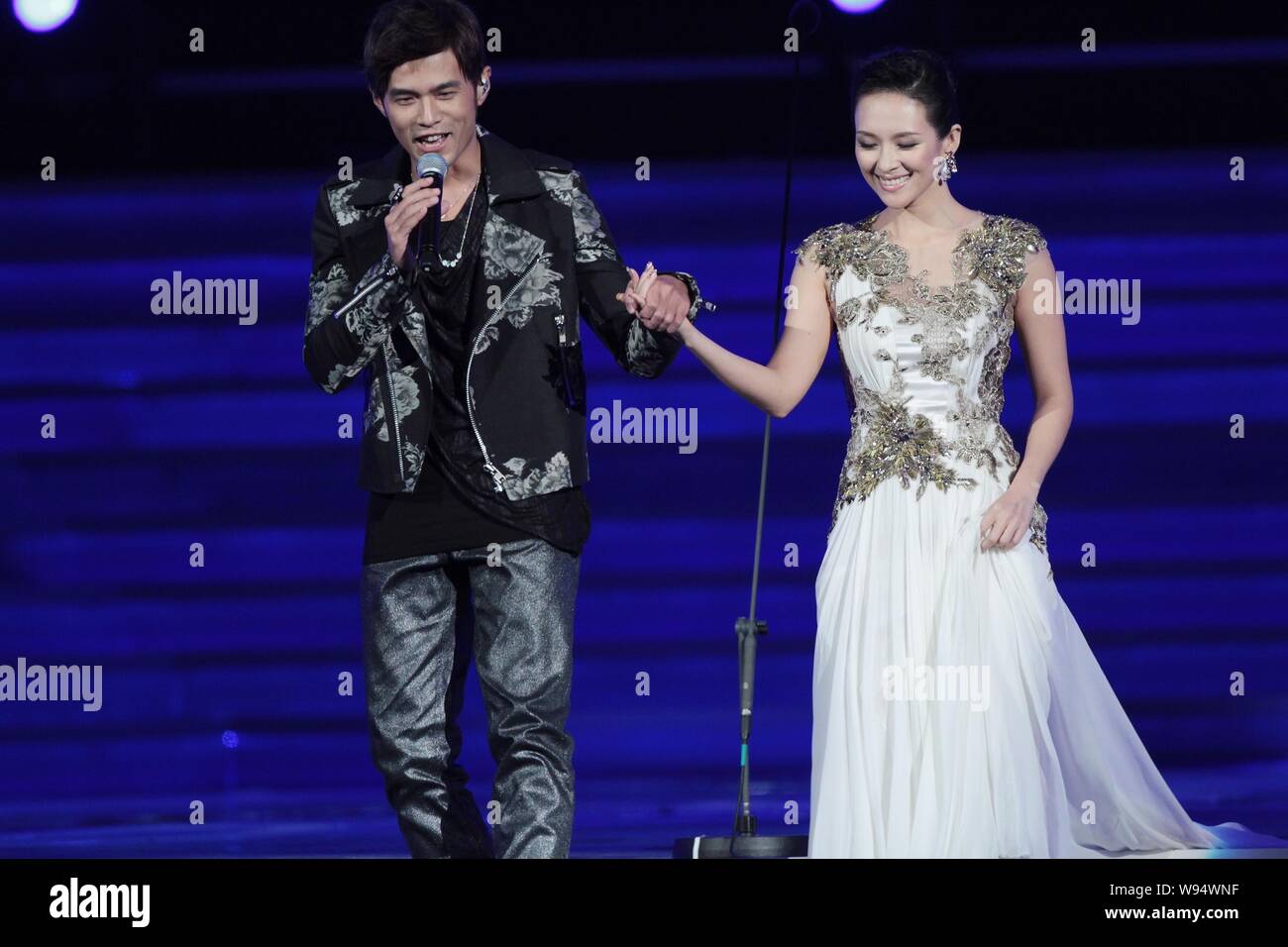 Taiwanese singer Jay Chou, left, performs with Chinese actress Zhang ...