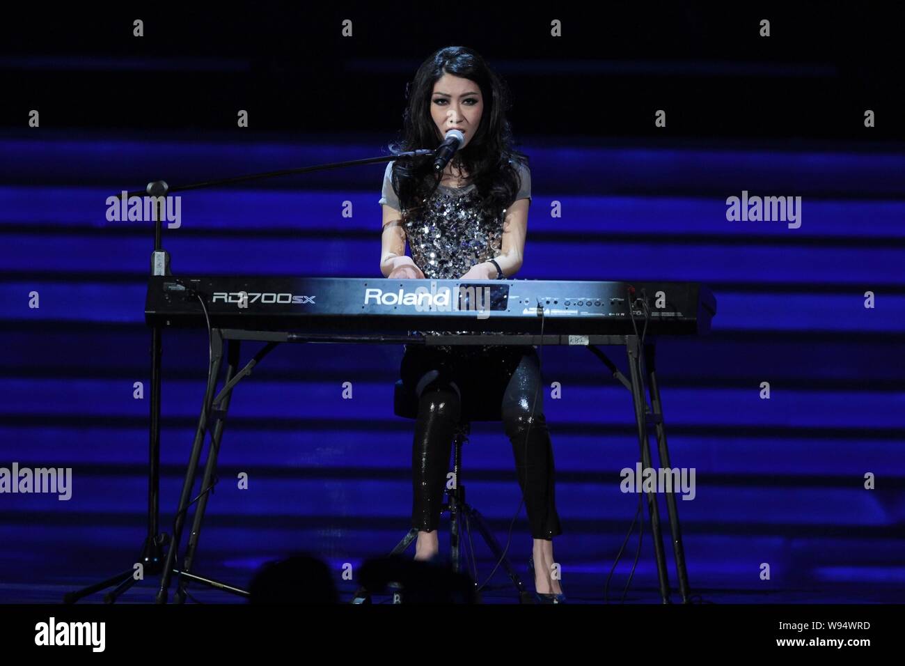 Canadian singer Qu Wanting performs during the Chinese Music Chart ...