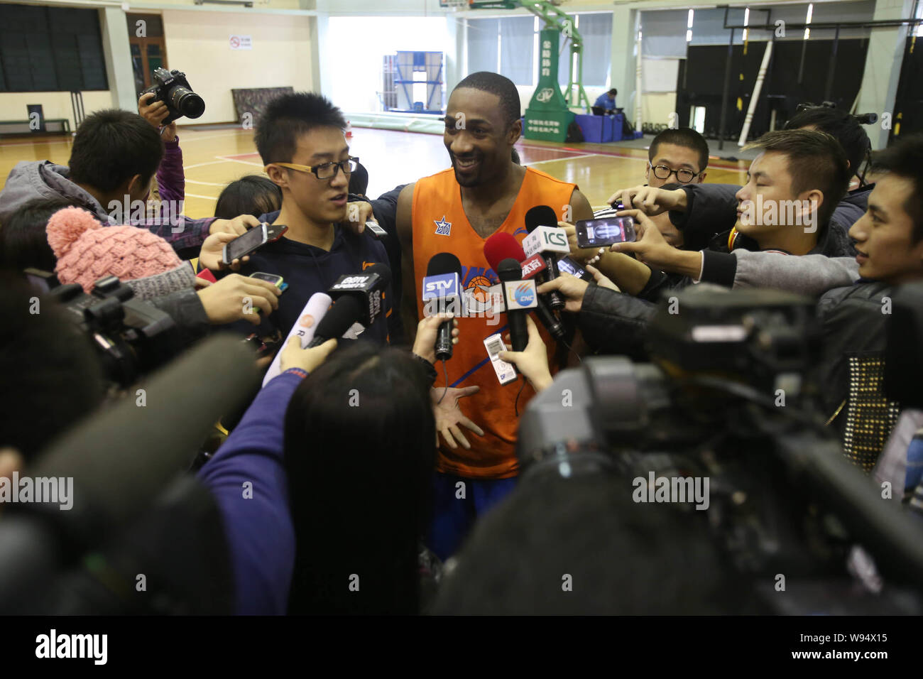 Gilbert Arenas of the Shanghai Sharks, center, is interviewed during a ...