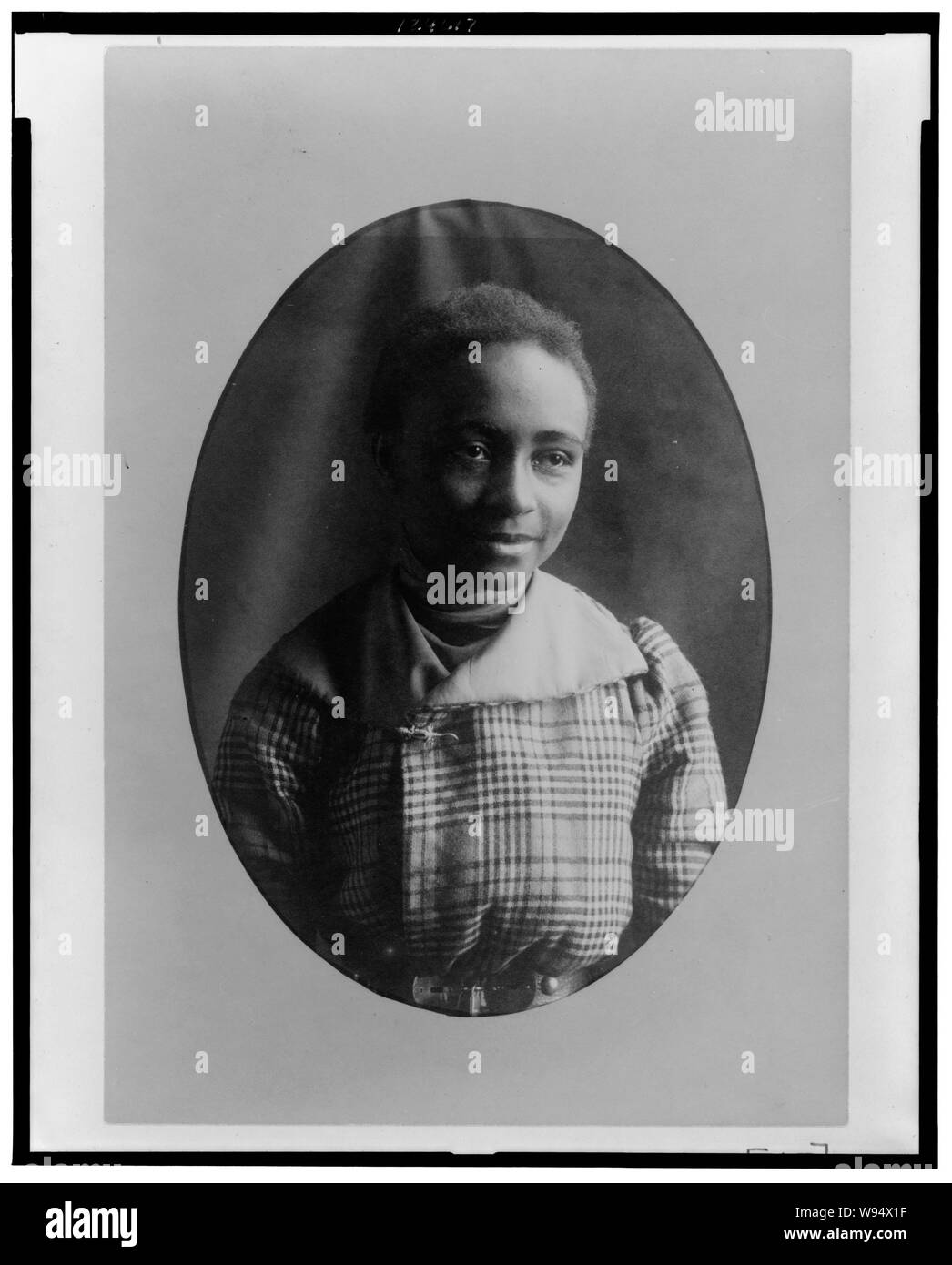 African American woman, half-length portrait, facing front, smiling ...