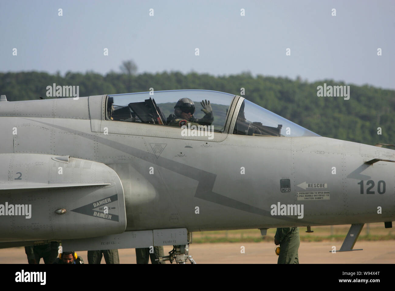 A Pakistani pilot waves in a JF-17 Thunder (FC-1 Xiaolong) fighter jet ...