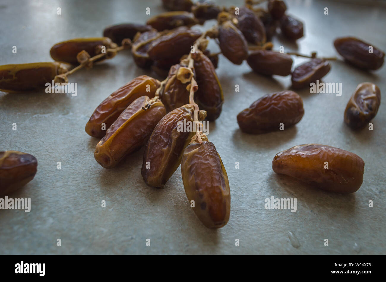Fresh organic dates on the branches Stock Photo - Alamy