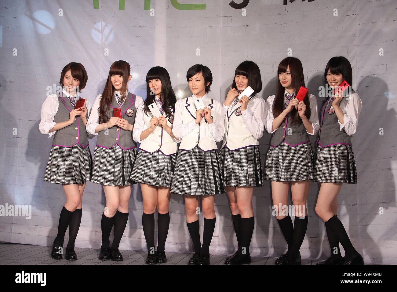Members of Japanese idol group Nogizaka46 pose during a fans meeting ...