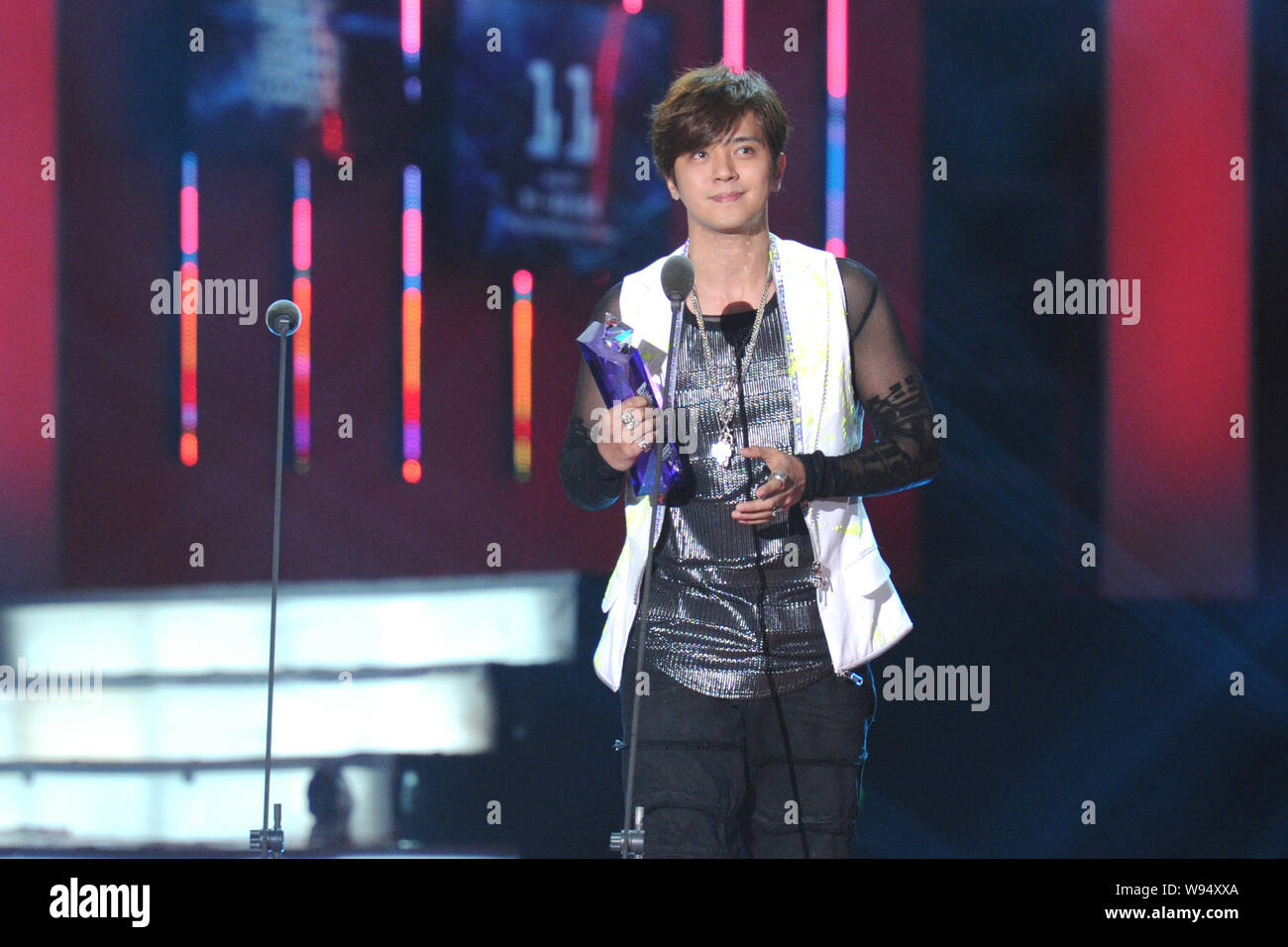 Taiwanese singer and actor Show Lo holds his trophy for the most ...