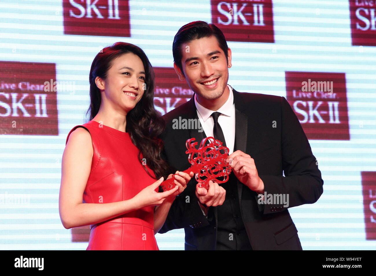Chinese actress Tang Wei poses with Taiwanese actor Godfrey Kao during ...