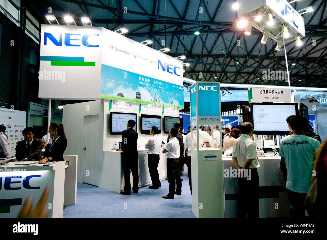 --File--Visitors are seen at the stand of NEC during a fair in Shanghai ...