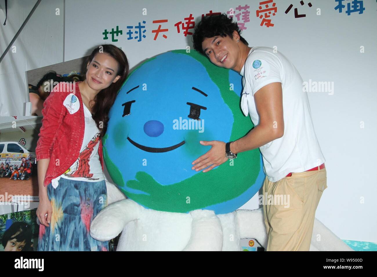 Taiwanese actor Peter Ho (R) and actress Shu Qi pose during the World ...