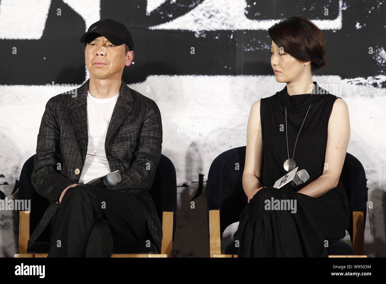 Chinese director Feng Xiaogang and actress Xu Fan smile at the press ...