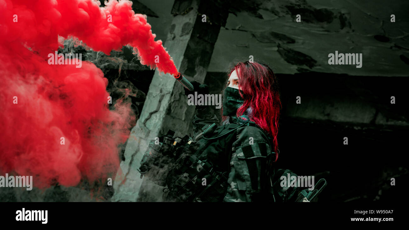 Red-hair woman in military uniform with alarm smoke fire in hand Stock ...