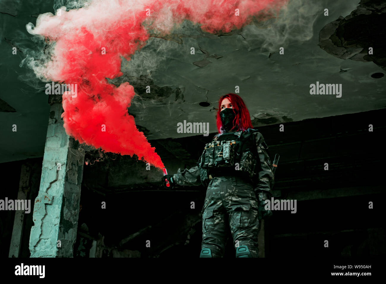 Red-hair woman in military uniform with alarm smoke fire in hand Stock ...