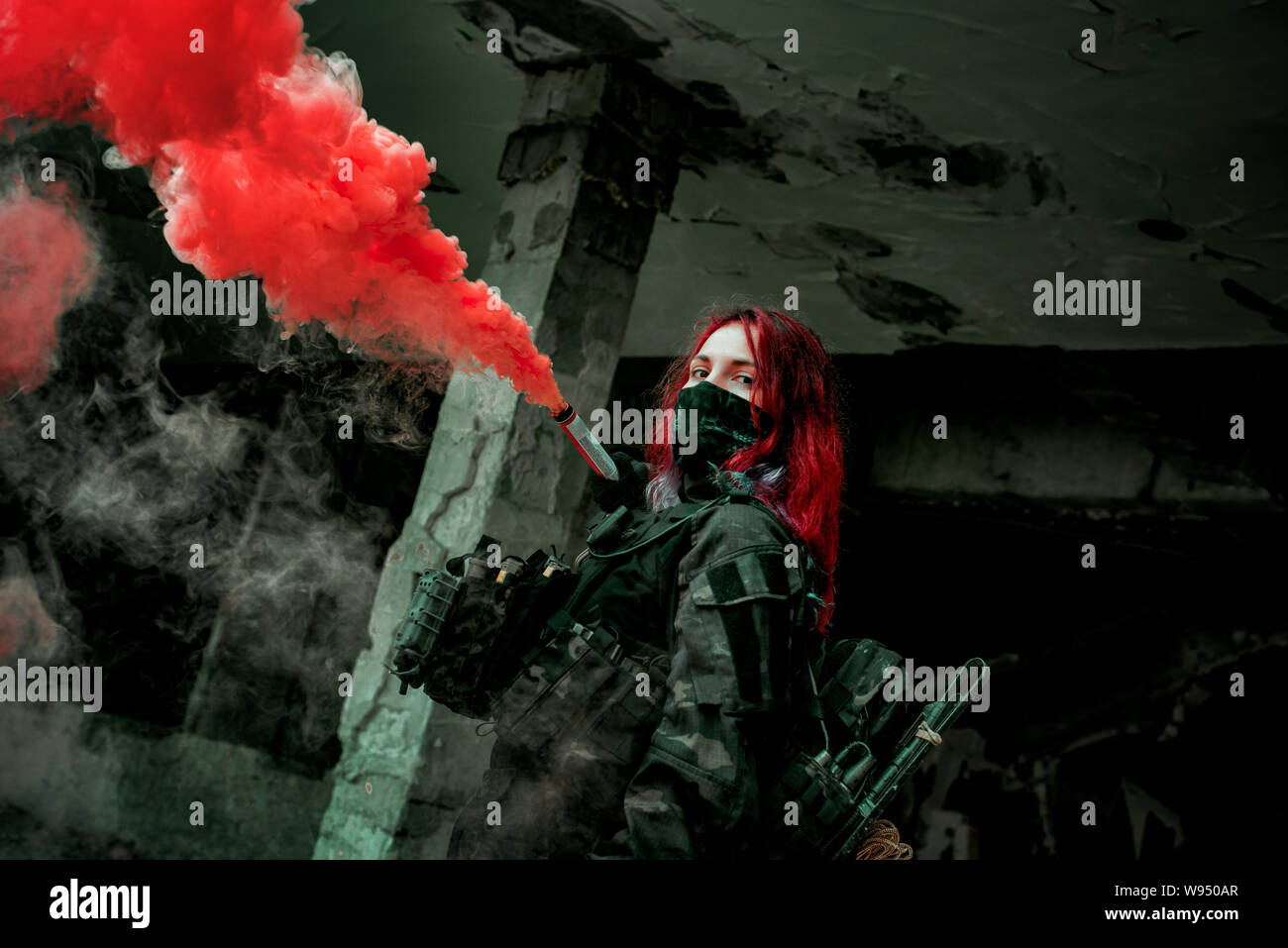 Red-hair woman in military uniform with alarm smoke fire in hand Stock ...