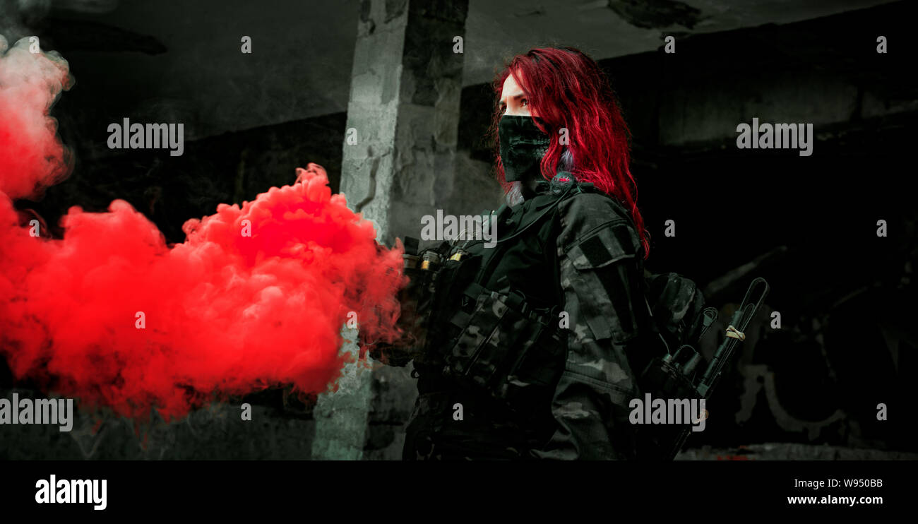 Red-hair woman in military uniform with alarm smoke fire in hand Stock ...