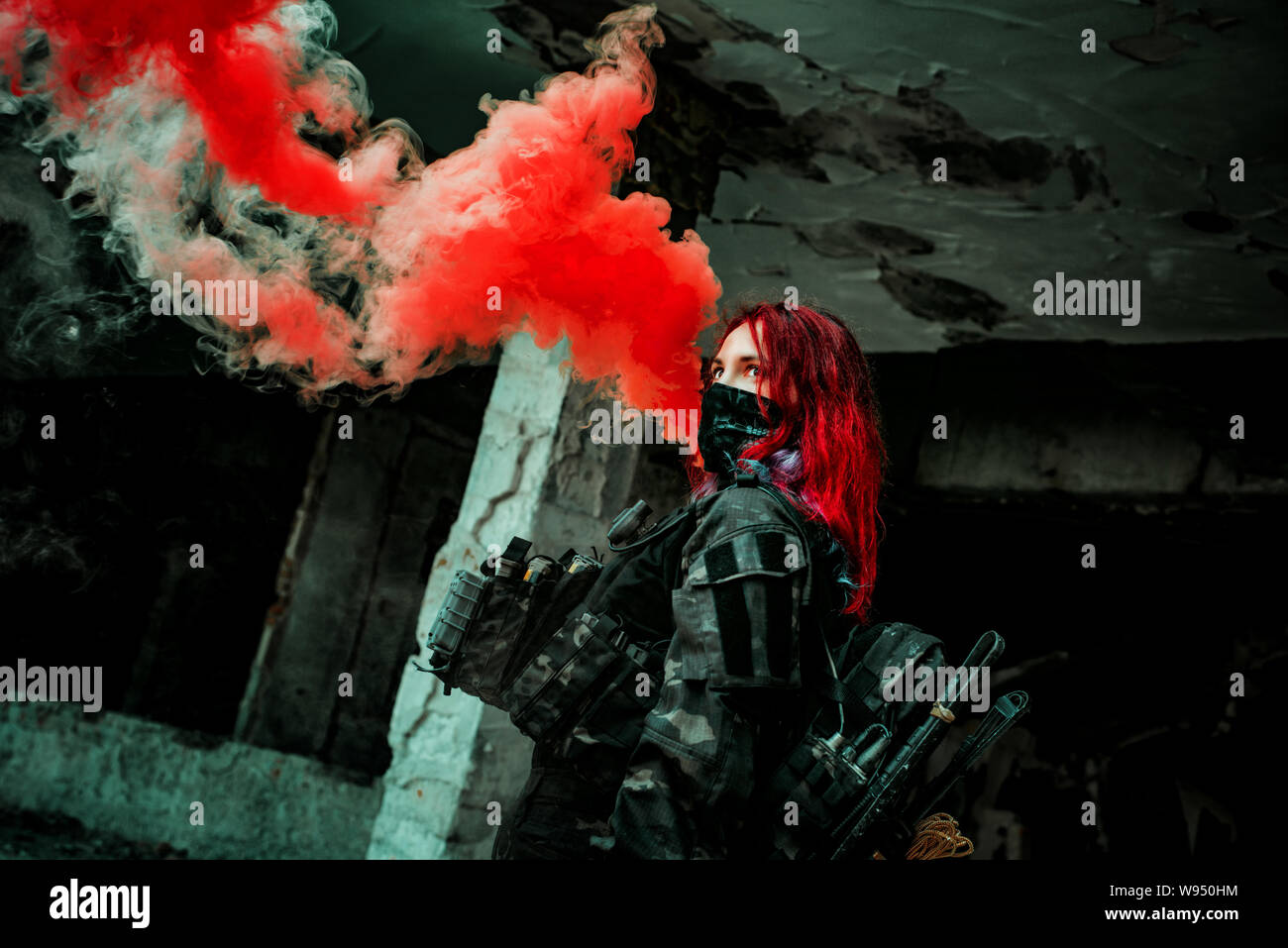 Red-hair woman in military uniform with alarm smoke fire in hand Stock ...