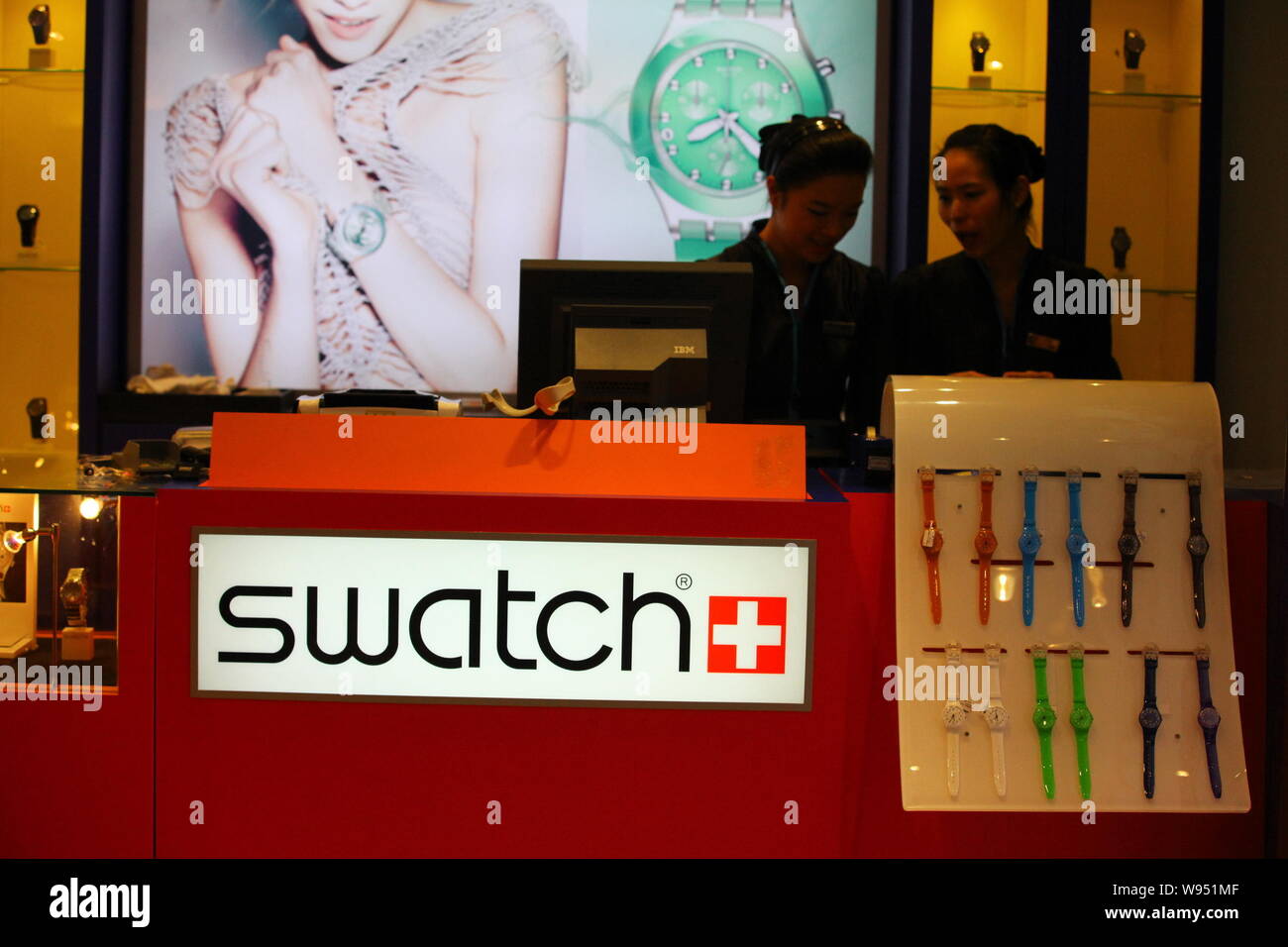 --File--Saleswomen are seen at a Swatch counter in a duty free store in ...