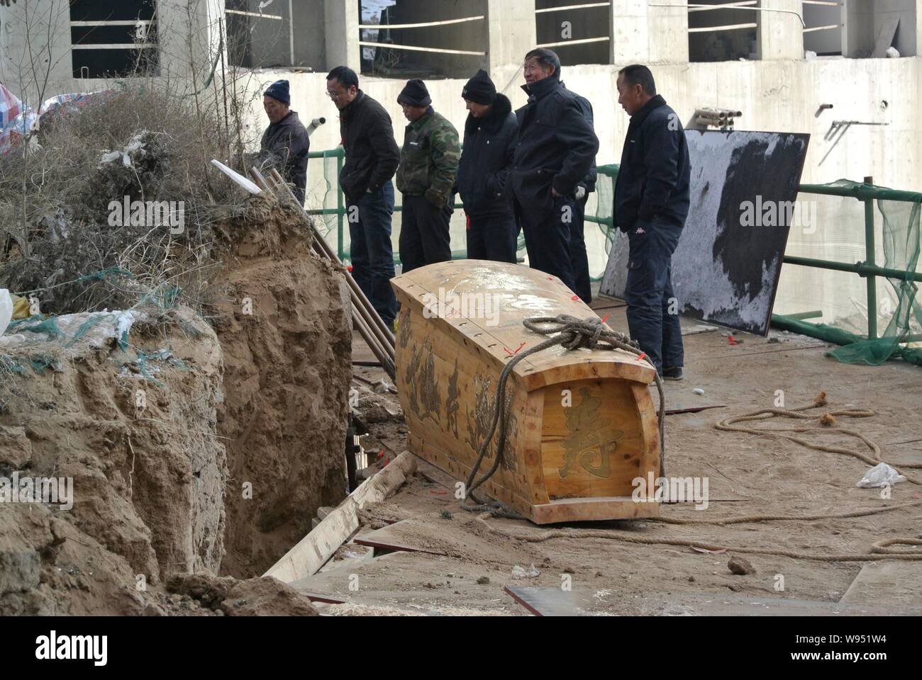 A coffin has been dug out from the grave site that was isolated on a ...