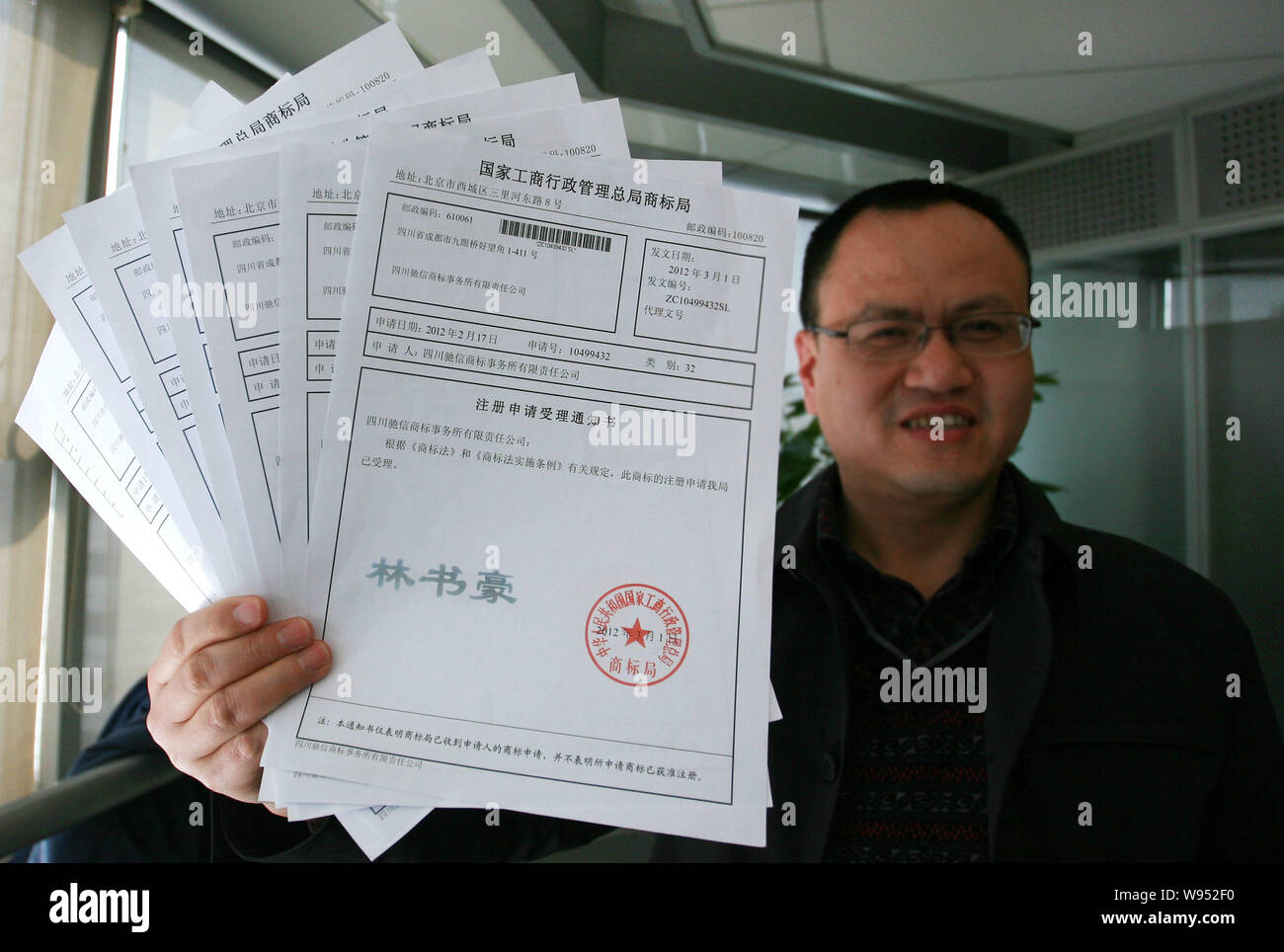 A businessman shows off his trademark application for Jeremy Lins ...