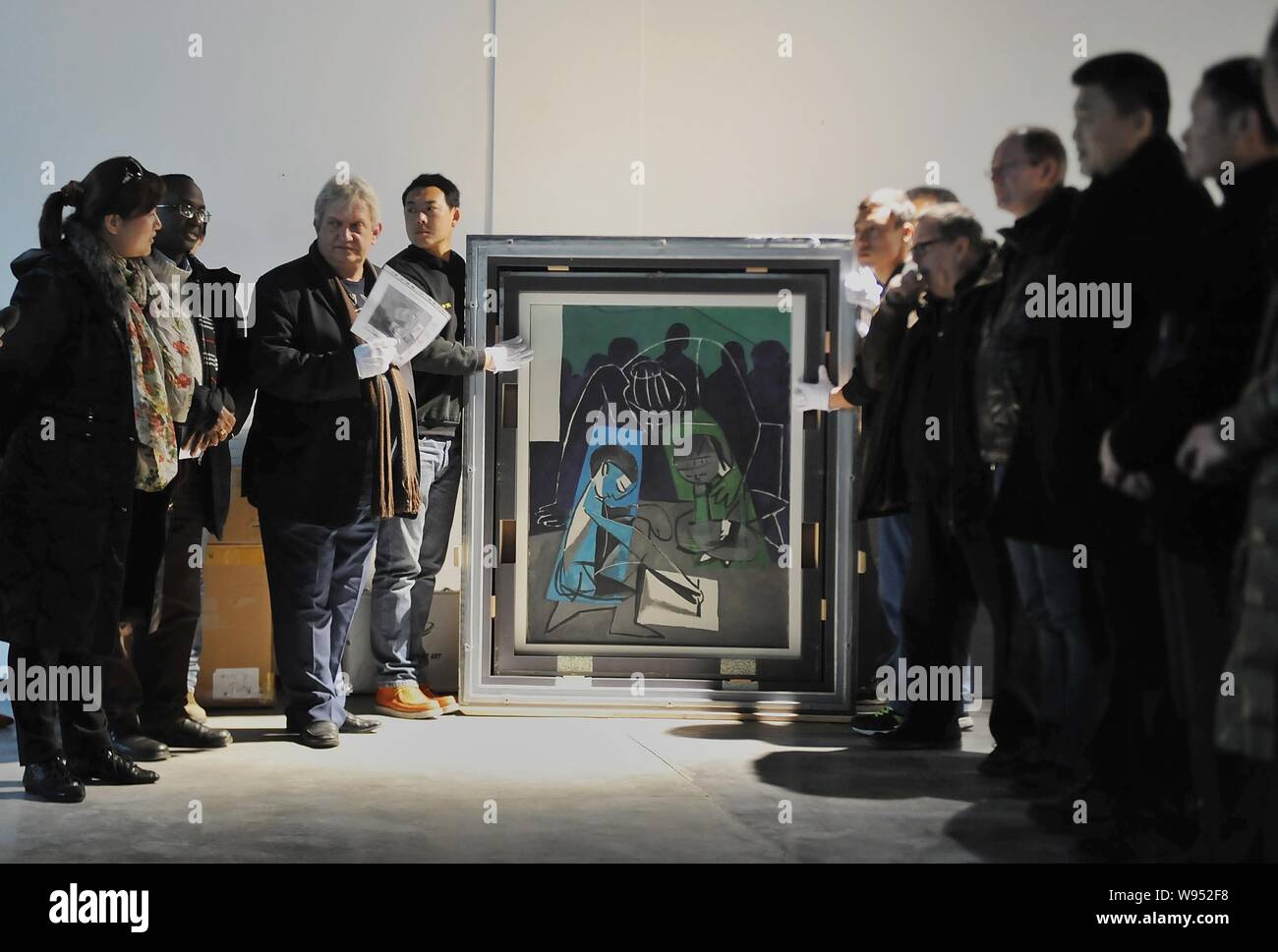Chengdu customs officers inspect a piece of painting by Spanish artist ...
