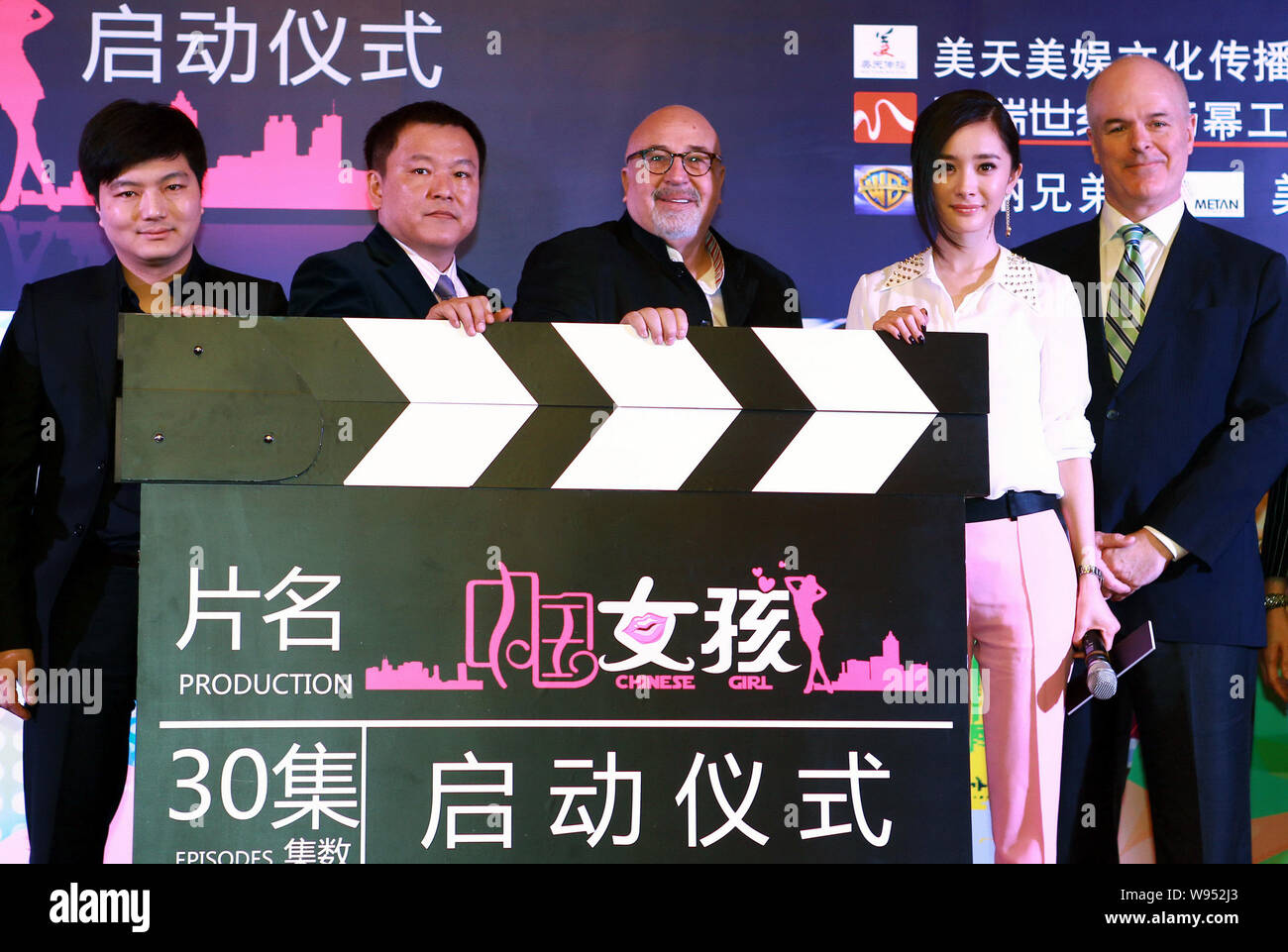 Chinese actress Yang Mi, second right, attends a ceremony for the start ...