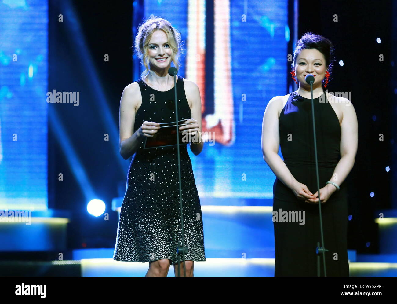American actress Heather Graham (L) and Chinese singer Huang Ying are ...