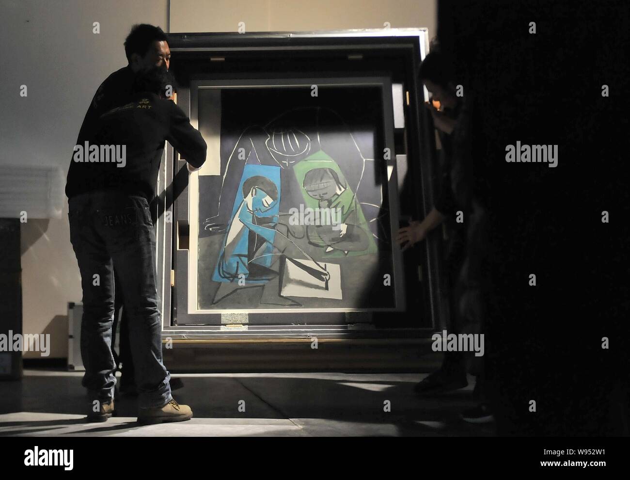 Chengdu customs officers inspect a piece of painting by Spanish artist ...
